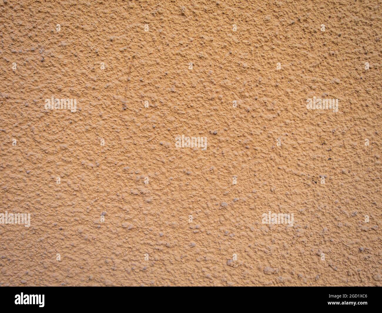 Orange-colored bumpy spotted rough wall texture Stock Photo - Alamy