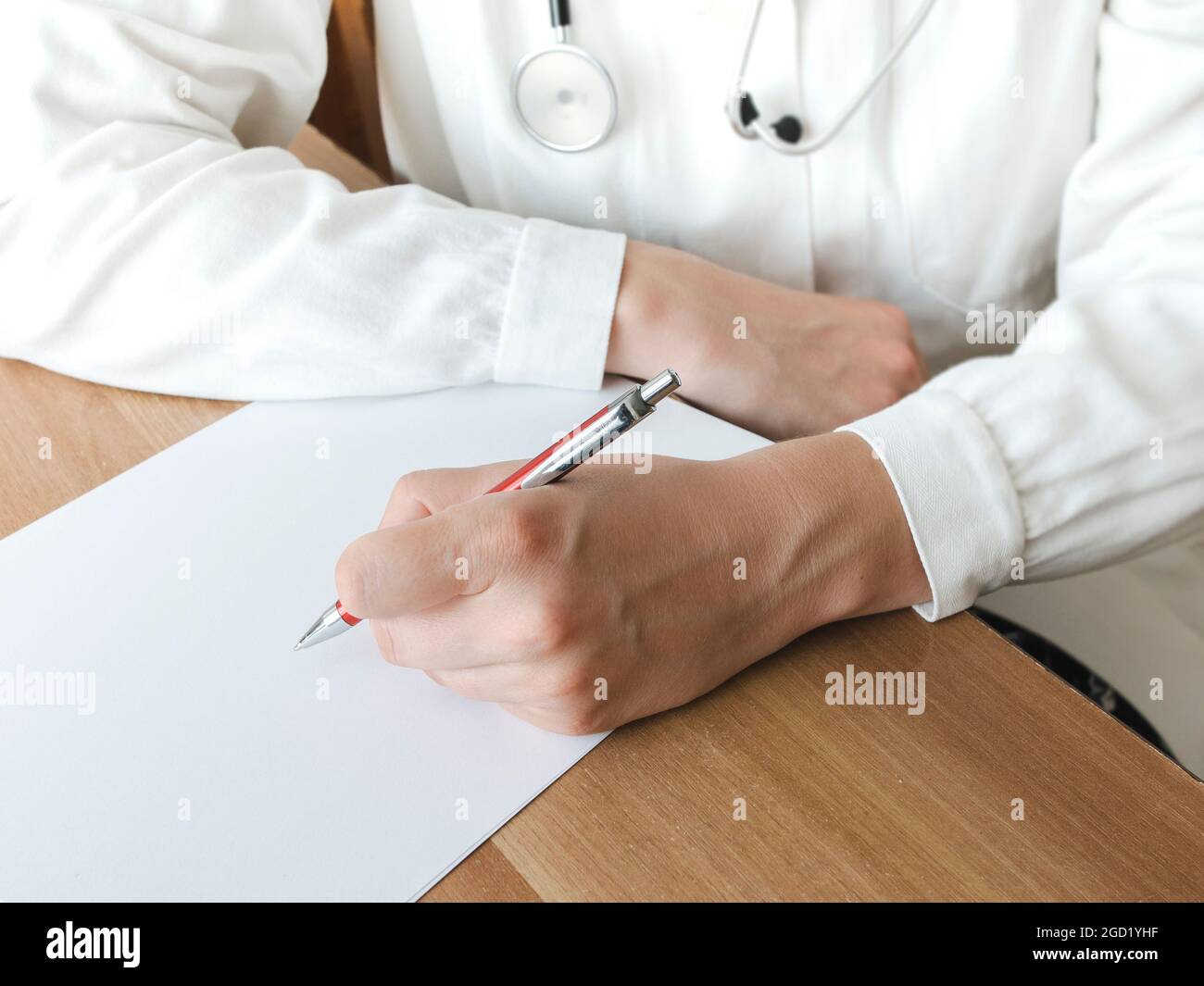 Doctor professional writing in office hi-res stock photography and ...