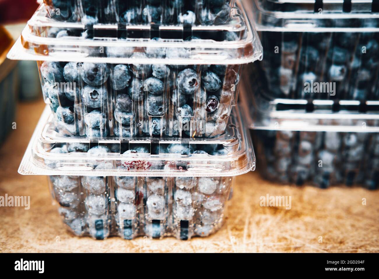 Fresh organic blueberries in plastic containers at local farmers market ...