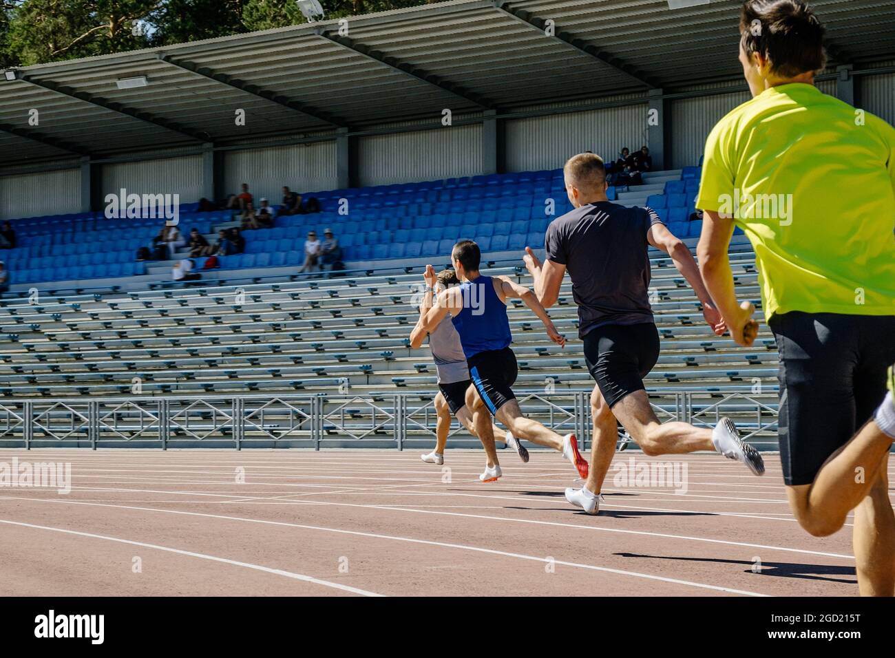 group male athletes run sprint race at competition Stock Photo - Alamy