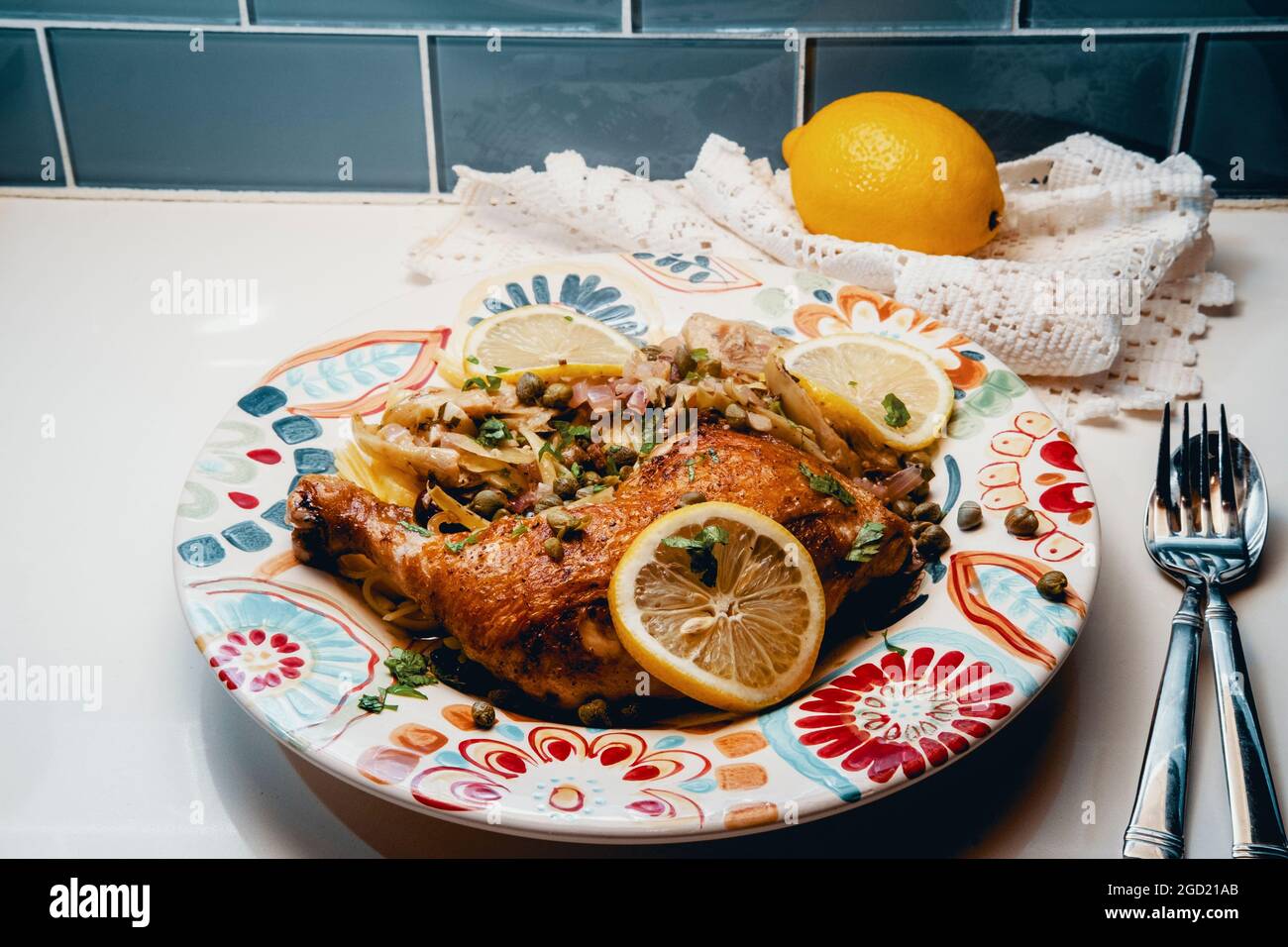 Italian split chicken leg piccata with linguine, artichoke hearts and ...