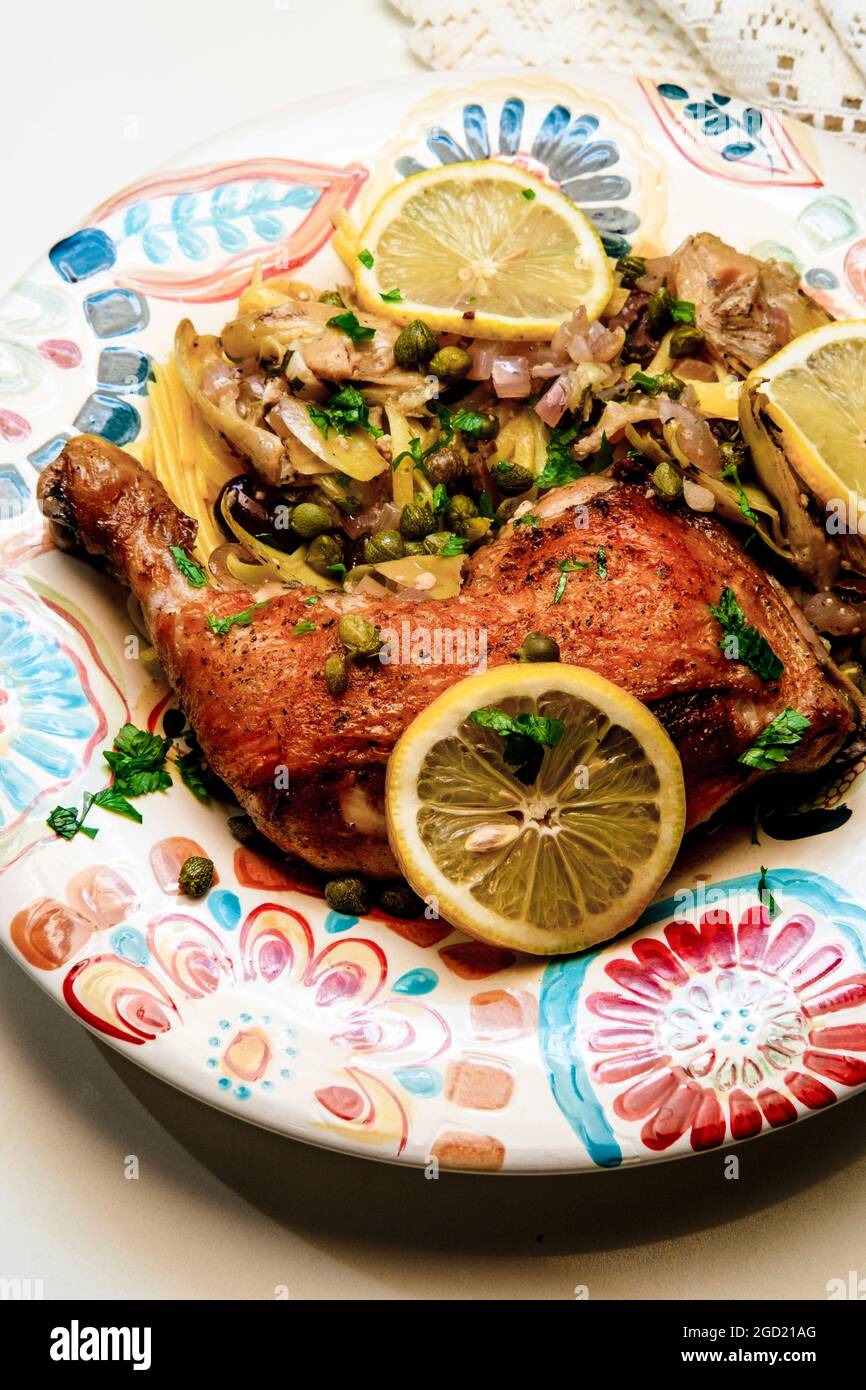 Italian split chicken leg piccata with linguine, artichoke hearts and ...