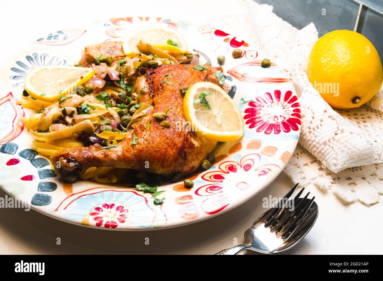 Italian split chicken leg piccata with linguine, artichoke hearts and ...