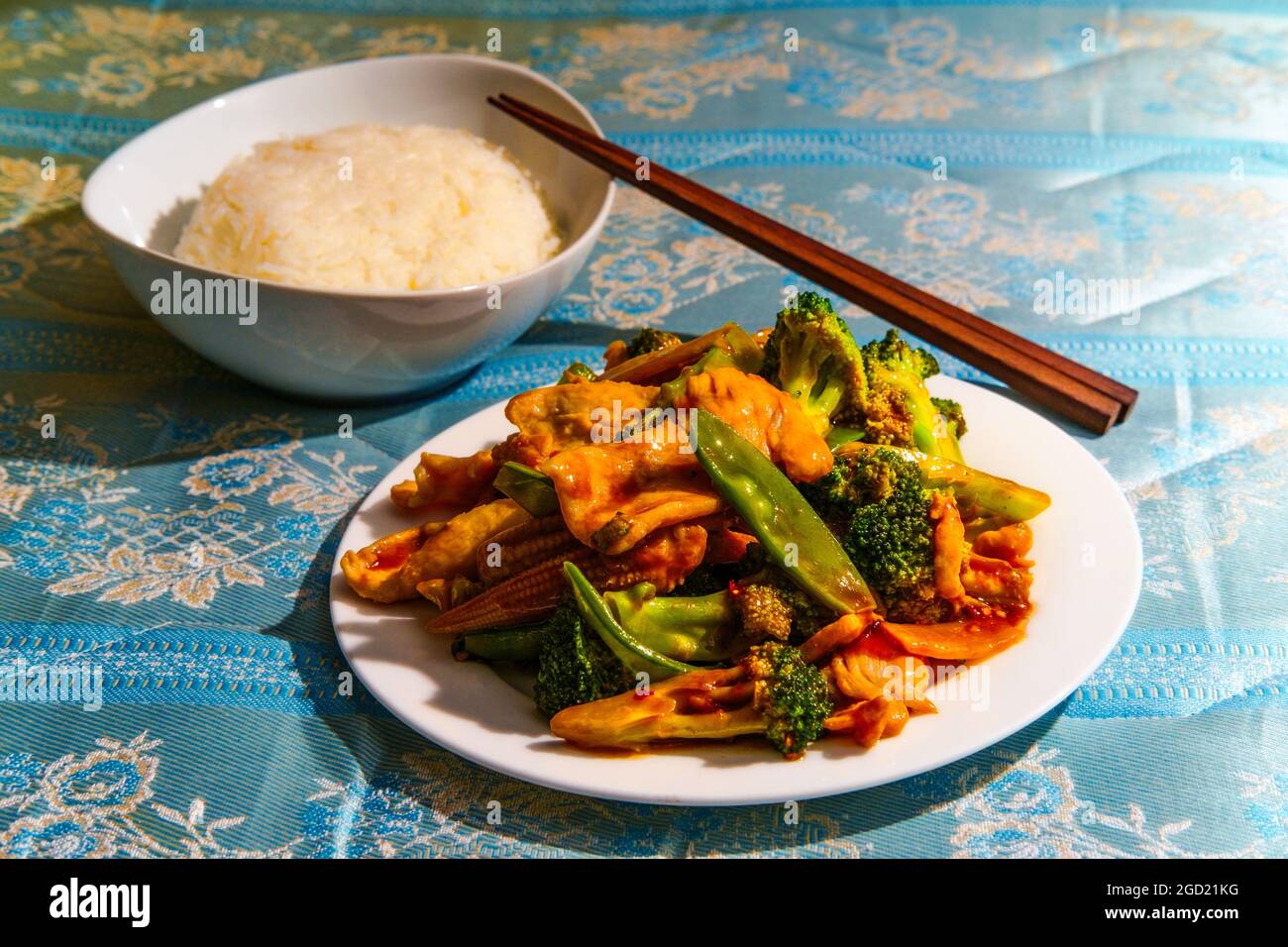 Chinese Hunan style spicy chicken with mixed sauteed vegetables and ...