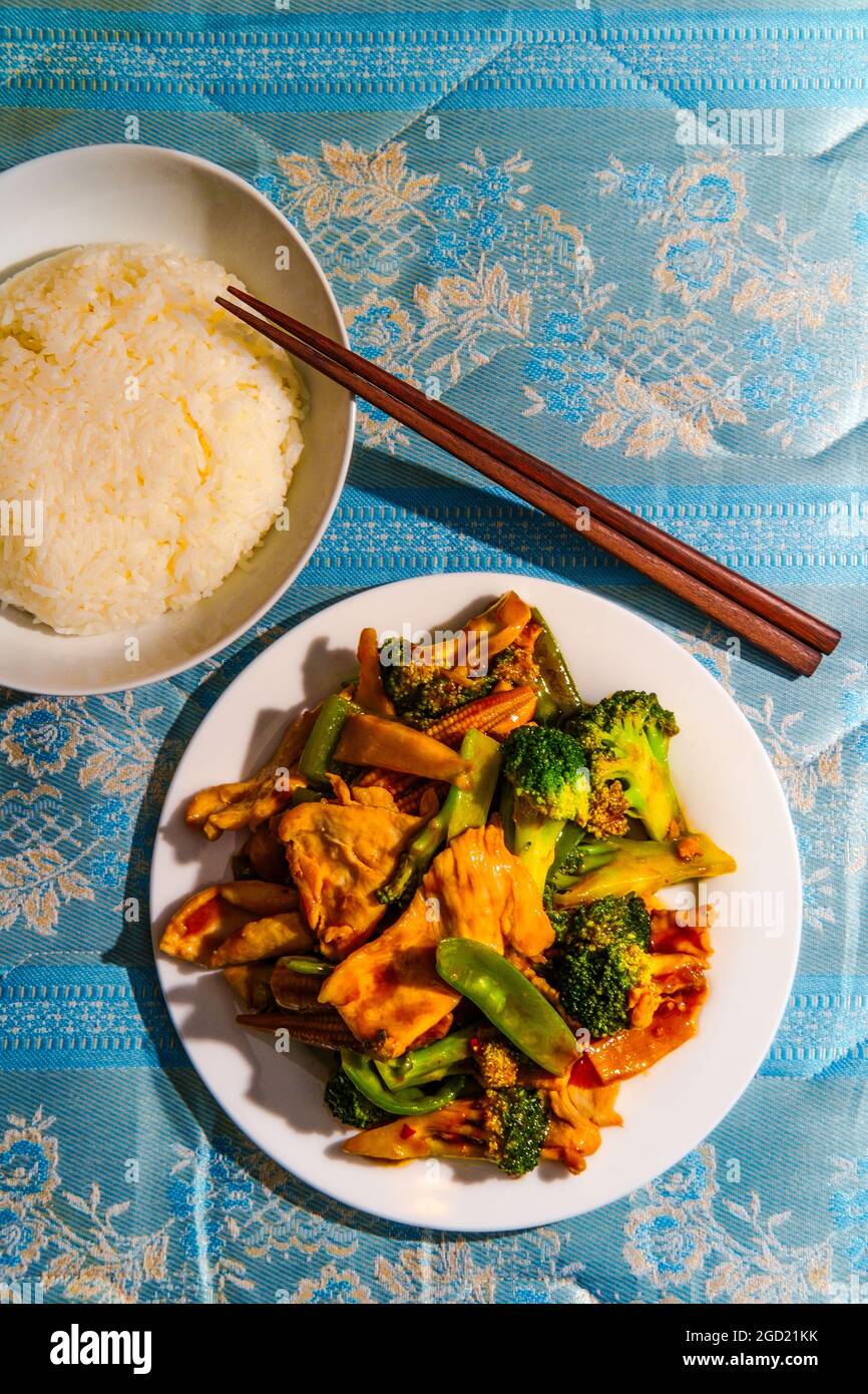 Chinese Hunan style spicy chicken with mixed sauteed vegetables and ...