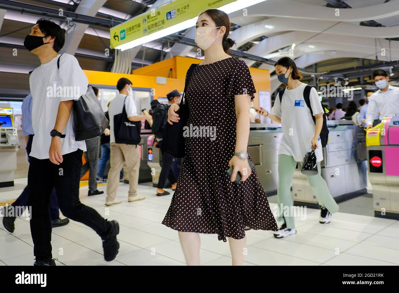 Tokyo, Japan. 15th July, 2021. Commuters wearing face masks as a ...
