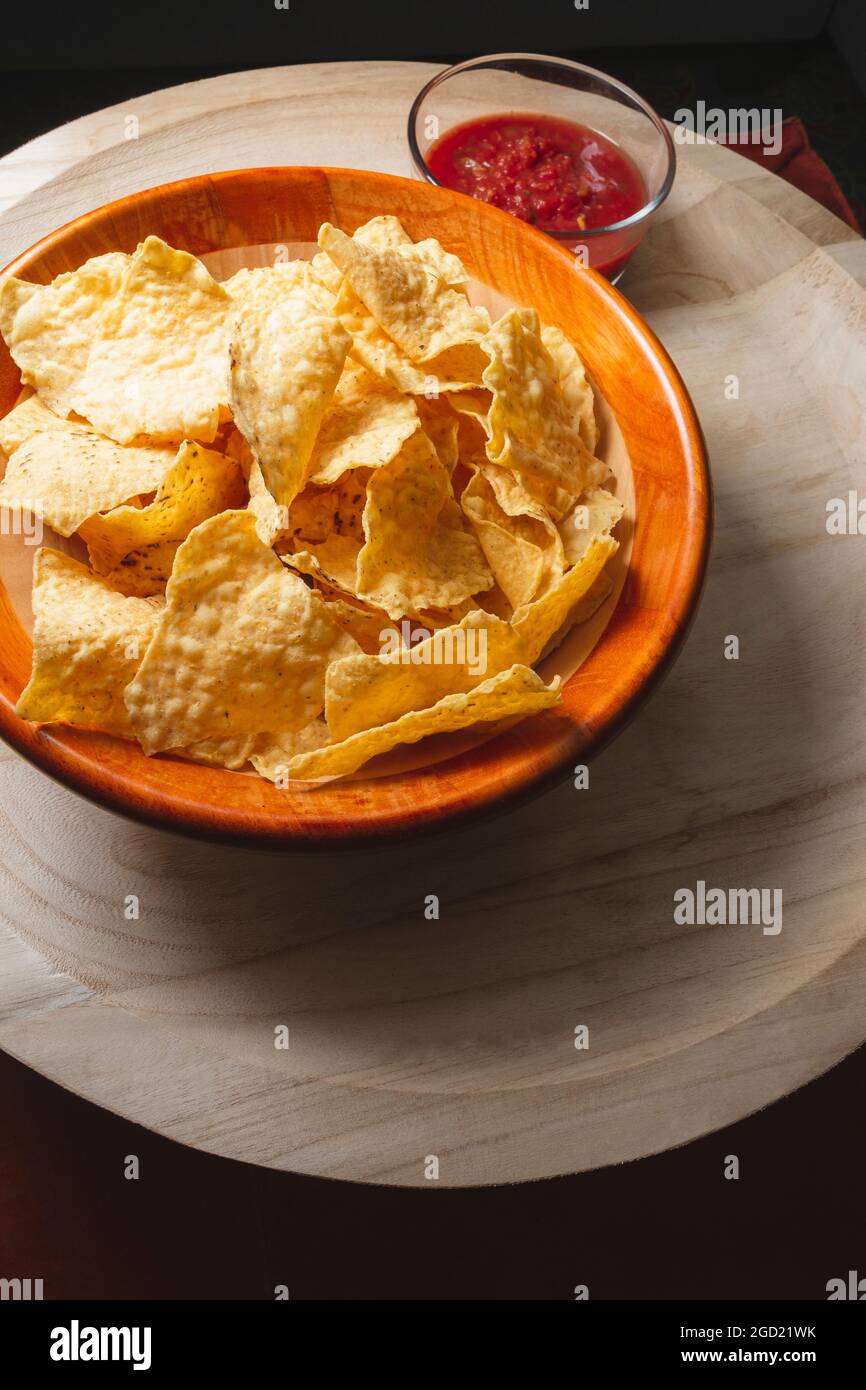Mexican crispy tortilla chips with spicy red tomato salsa Stock Photo ...