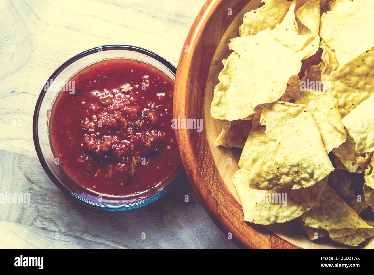 Mexican crispy tortilla chips with spicy red tomato salsa Stock Photo ...