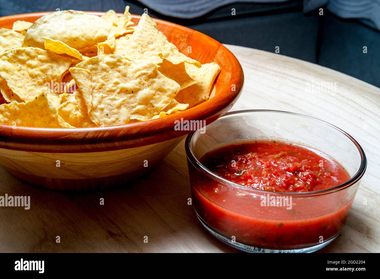 Mexican crispy tortilla chips with spicy red tomato salsa Stock Photo ...
