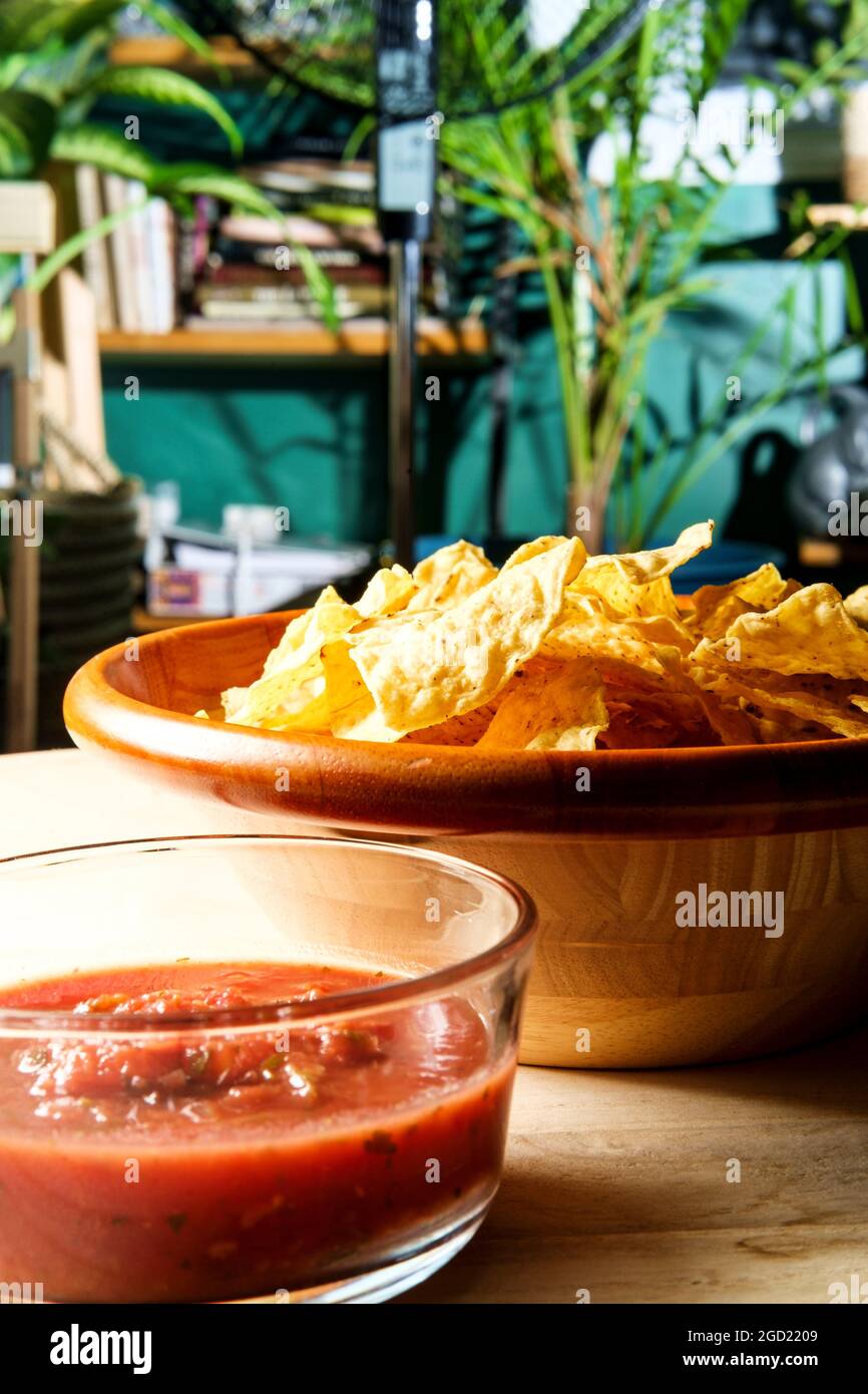 Mexican crispy tortilla chips with spicy red tomato salsa Stock Photo ...