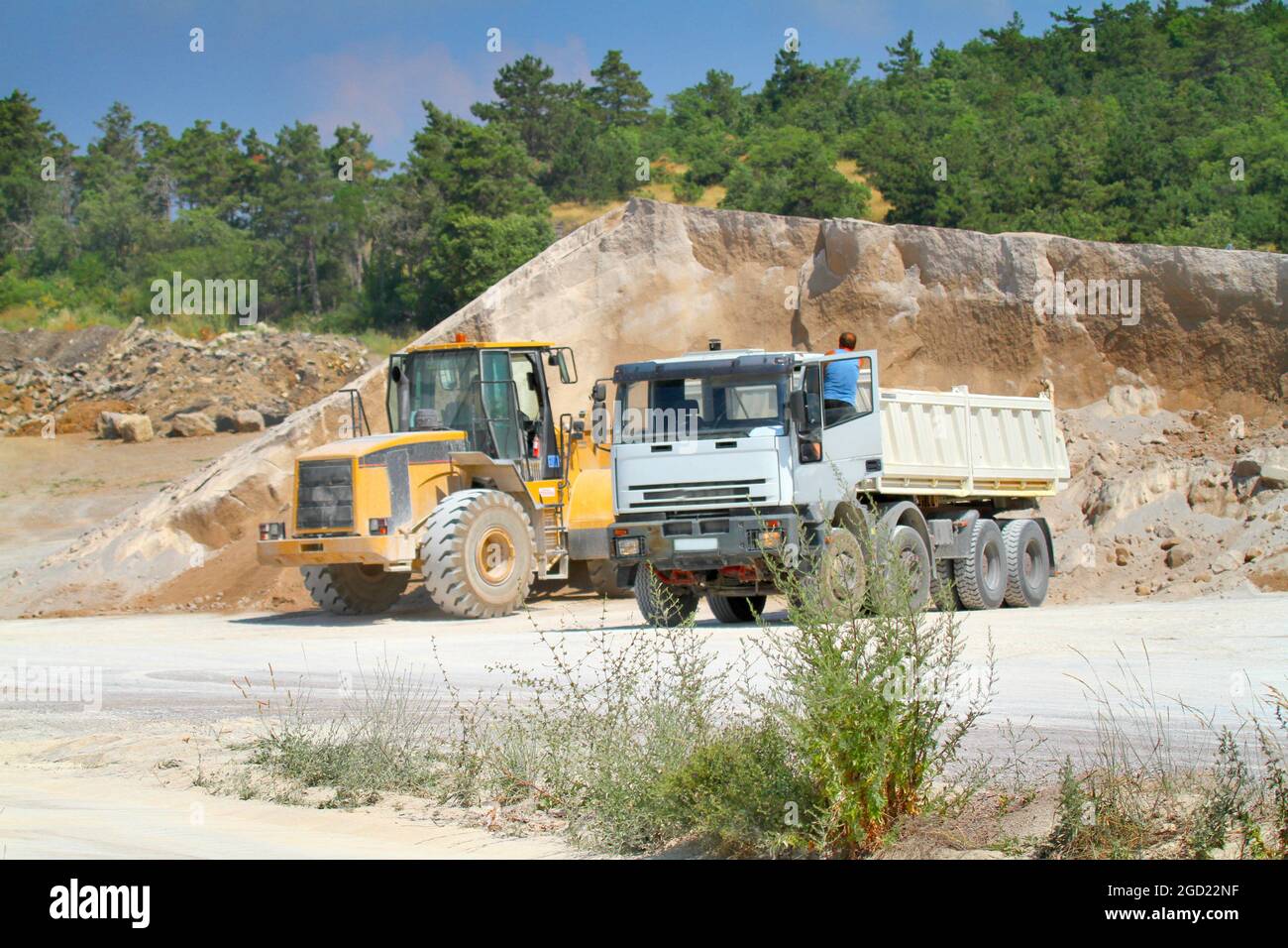 Industrial trucks working on a construction site Stock Photo - Alamy