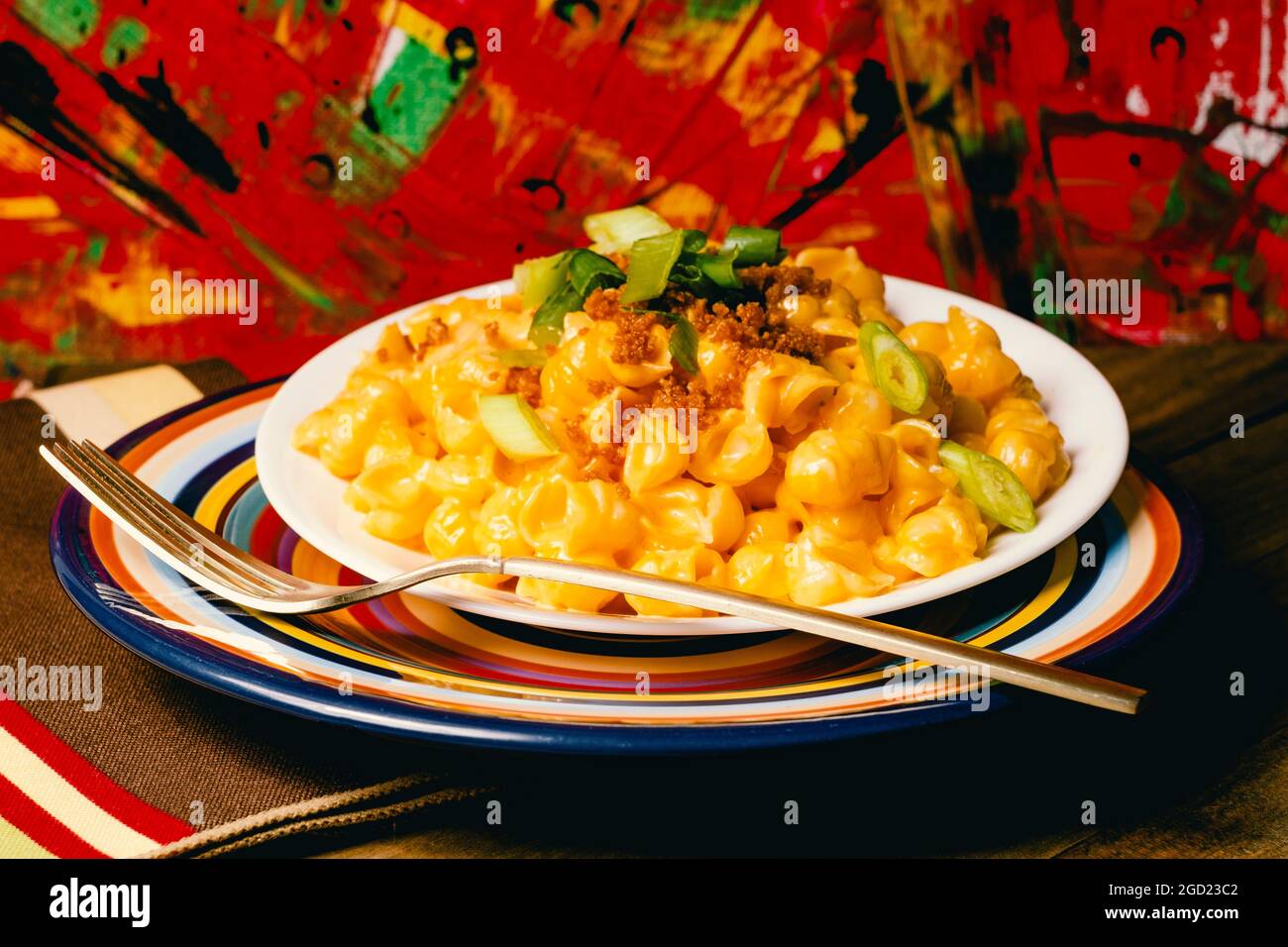 Stylized pop fashion macaroni and cheese with abstract pink background ...