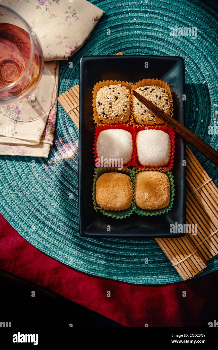 Japanese traditional dessert mochi served with glass of pink sake Stock ...