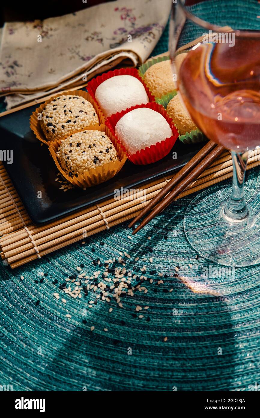 Japanese traditional dessert mochi served with glass of pink sake Stock ...