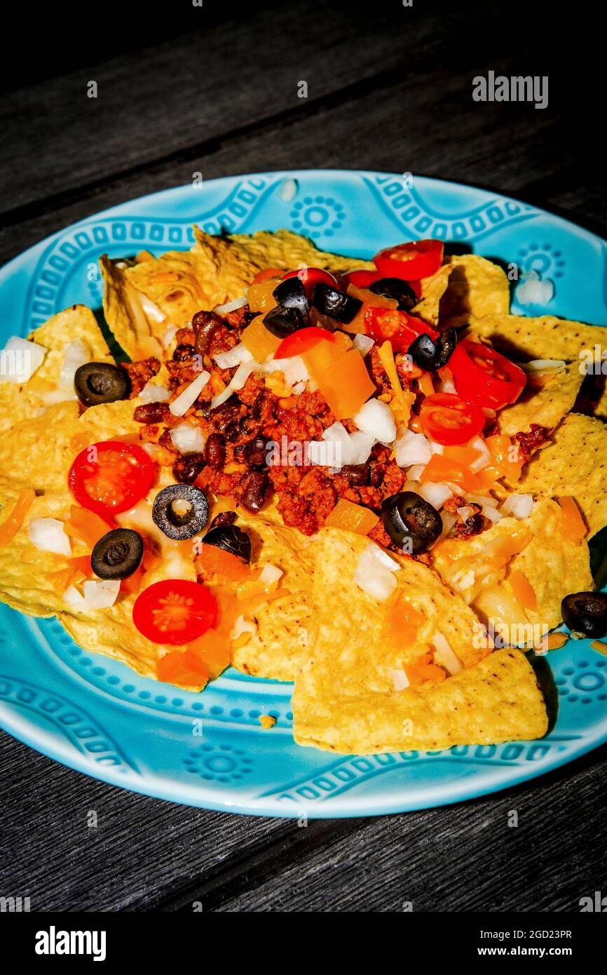 Simple beef nacho chips with chili and cheese Stock Photo - Alamy
