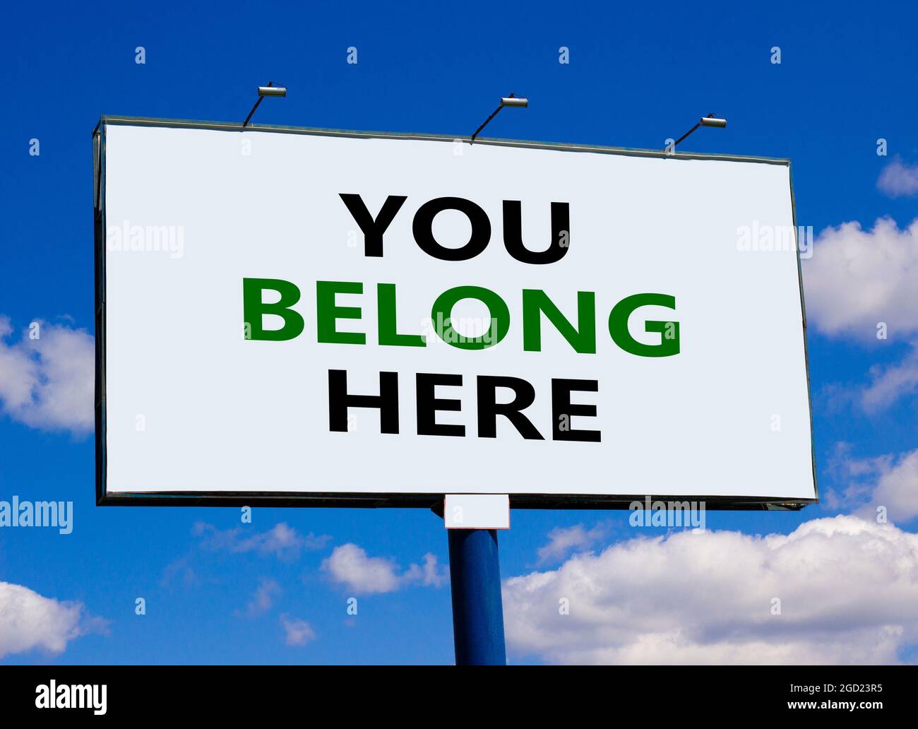 You belong here symbol. Words 'you belong here' on white billboard ...