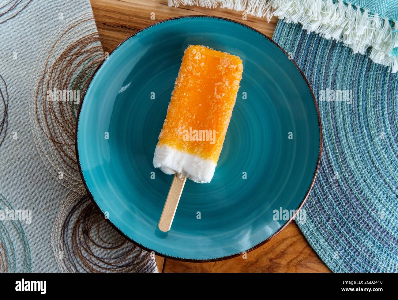 Refreshing frozen dessert Orange and cream ice pop on a stick Stock ...