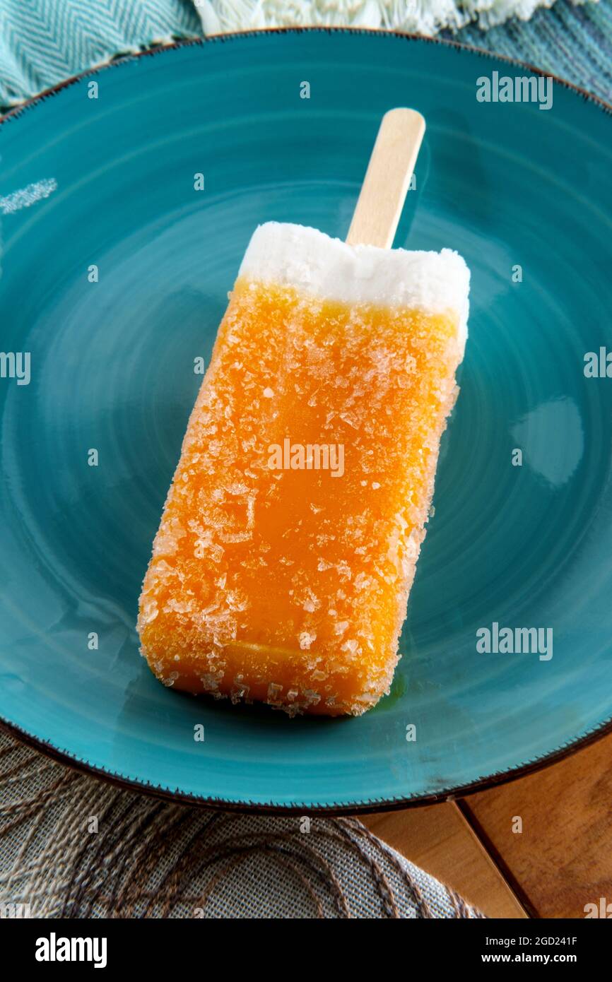 Refreshing frozen dessert Orange and cream ice pop on a stick Stock ...