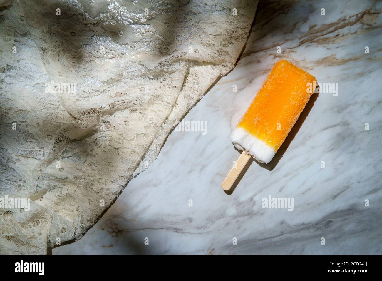 Refreshing frozen dessert Orange and cream ice pop on a stick Stock ...