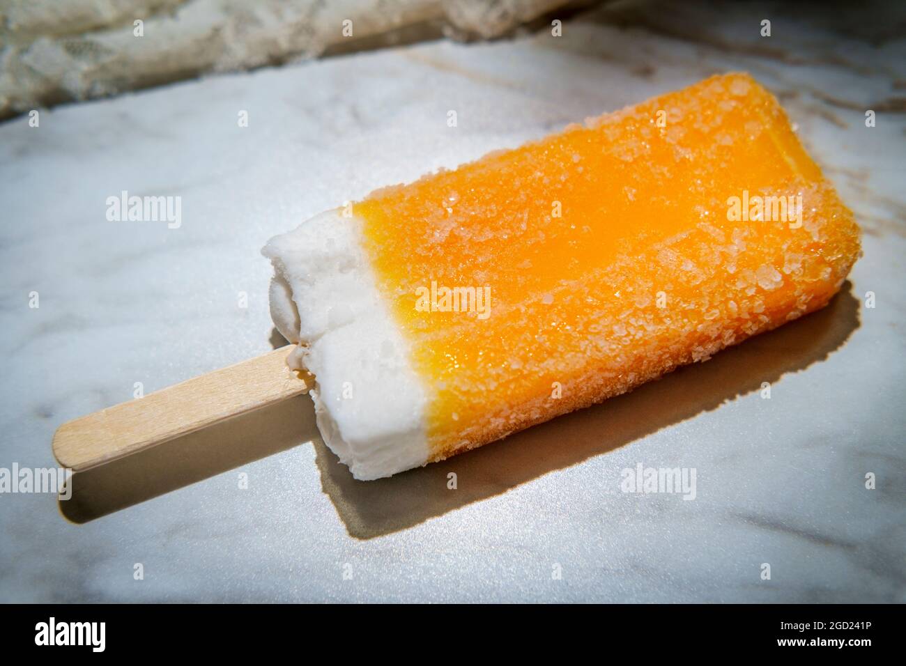 Refreshing frozen dessert Orange and cream ice pop on a stick Stock ...
