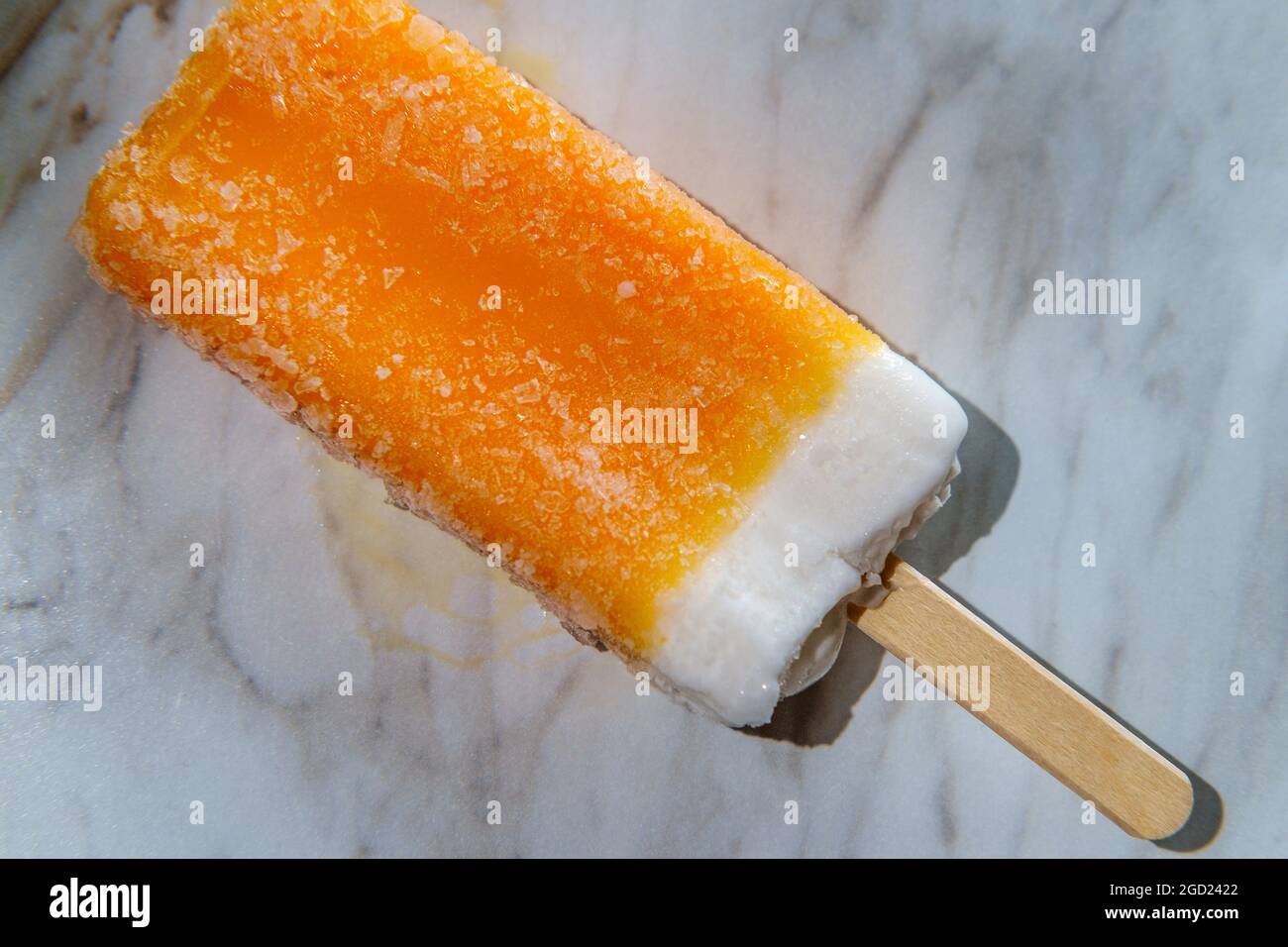 Refreshing frozen dessert Orange and cream ice pop on a stick Stock ...