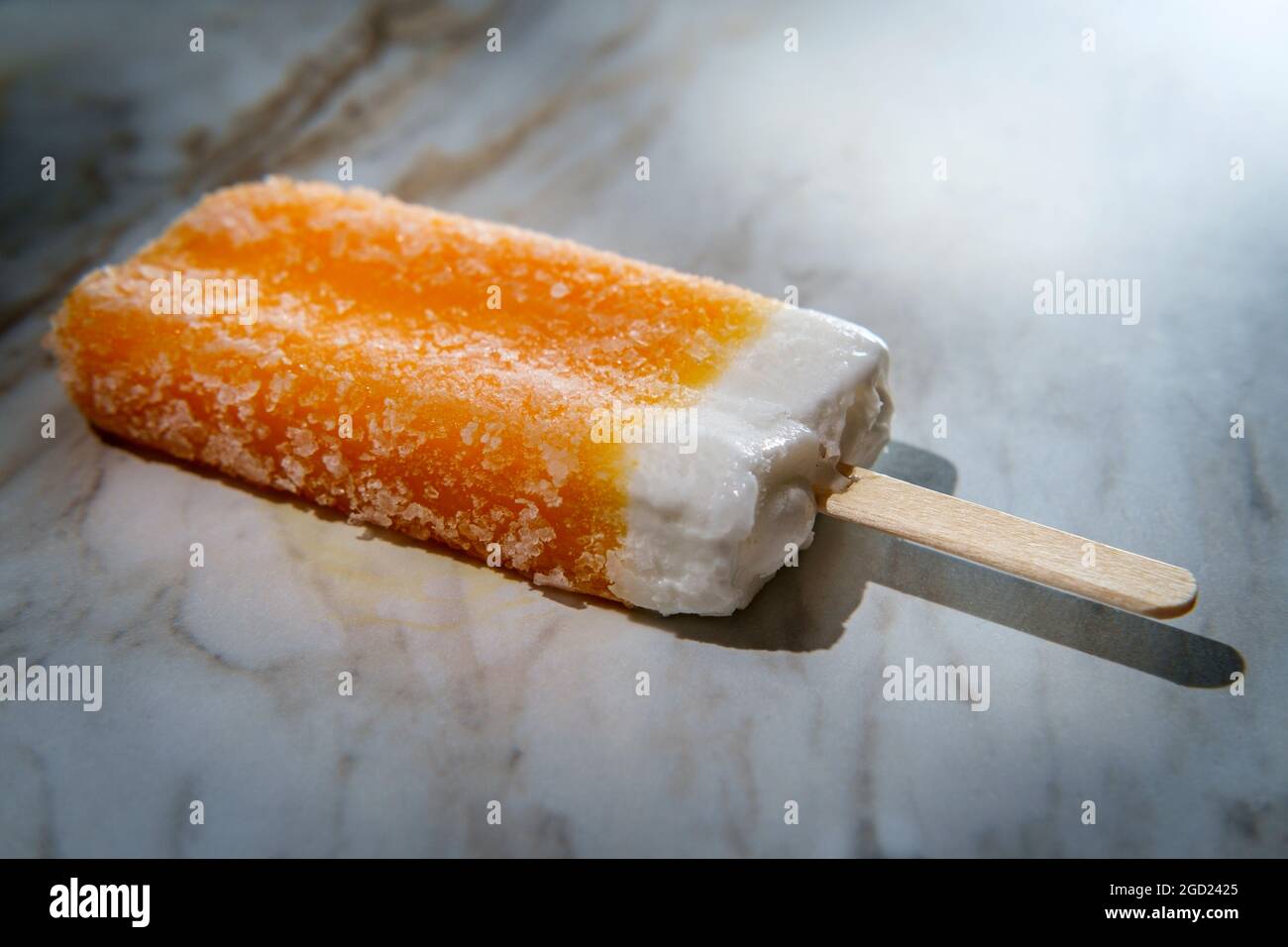 Refreshing frozen dessert Orange and cream ice pop on a stick Stock ...
