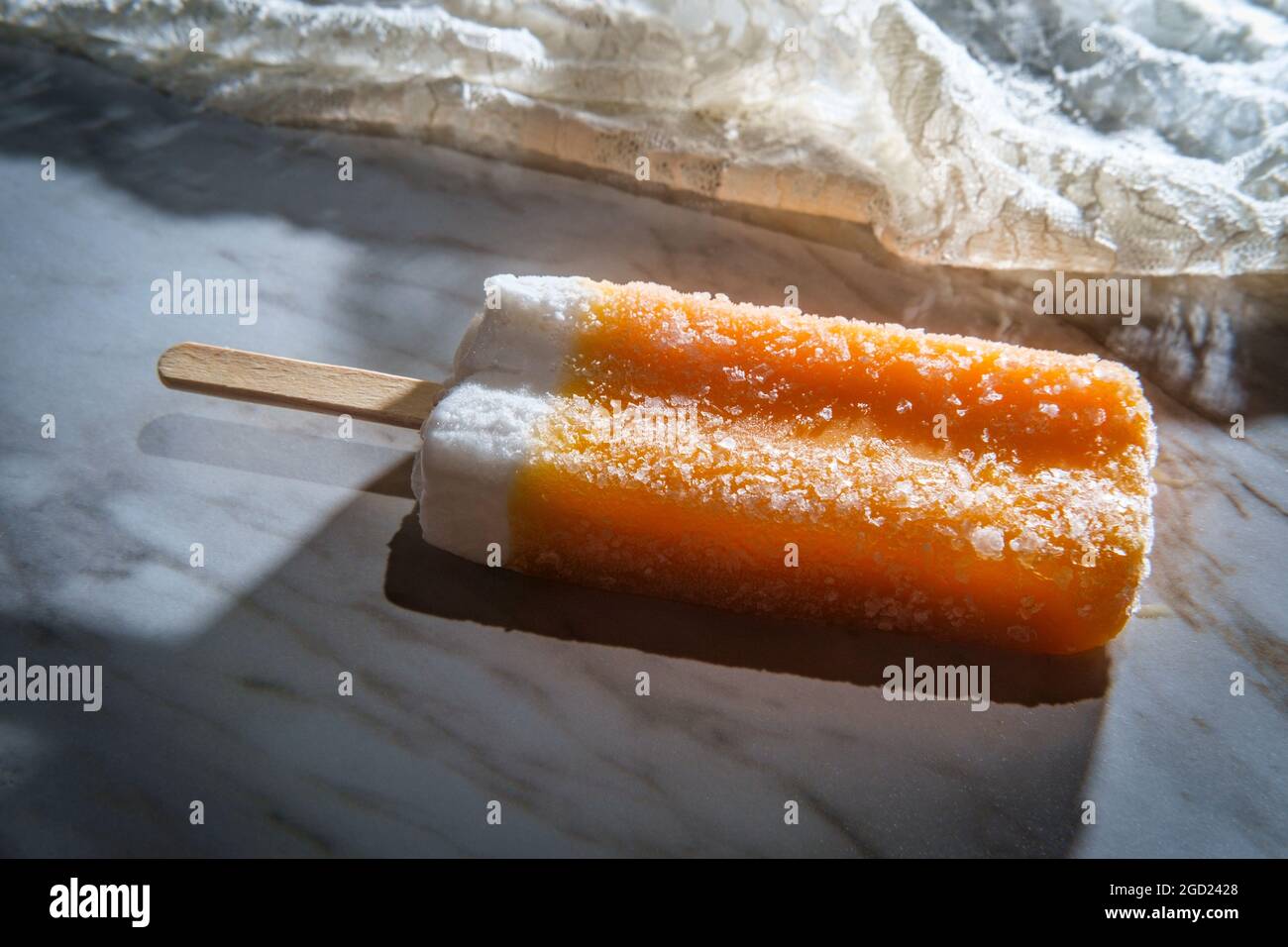 Refreshing frozen dessert Orange and cream ice pop on a stick Stock ...