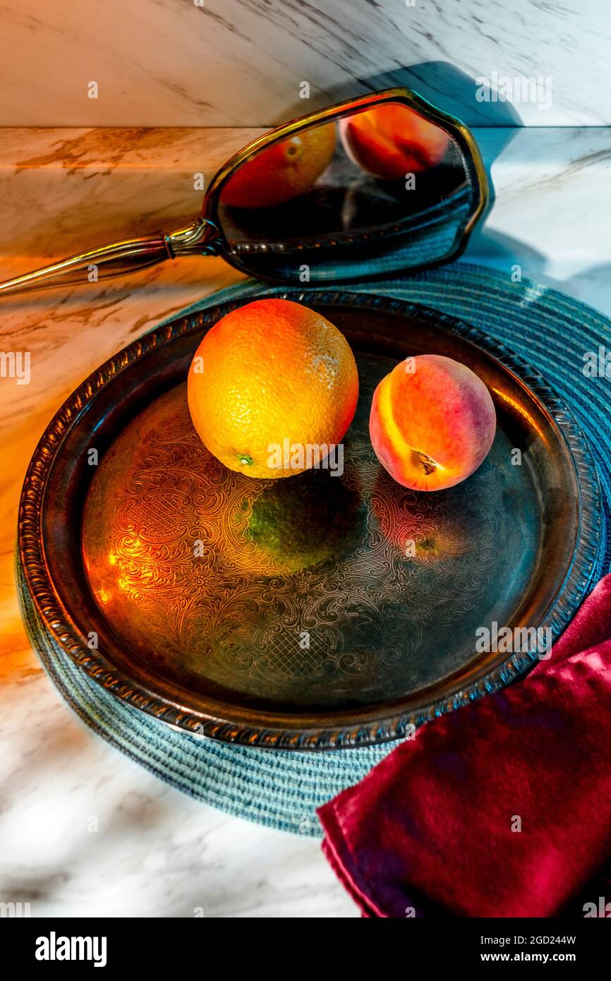 Fruit still life orange and peach with fancy drinking glass Stock Photo ...