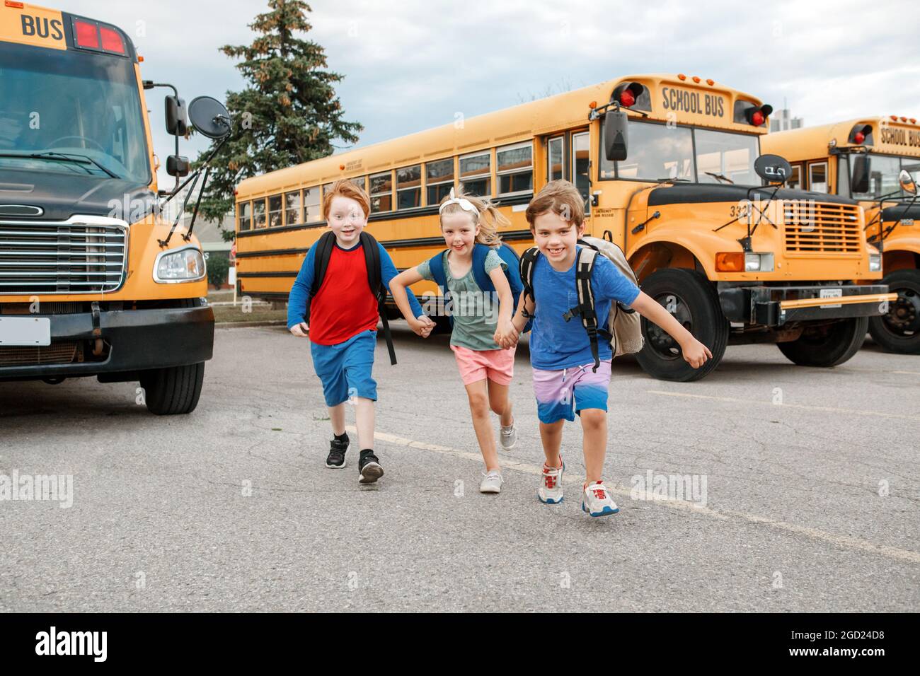 Children running school bus hi-res stock photography and images - Alamy