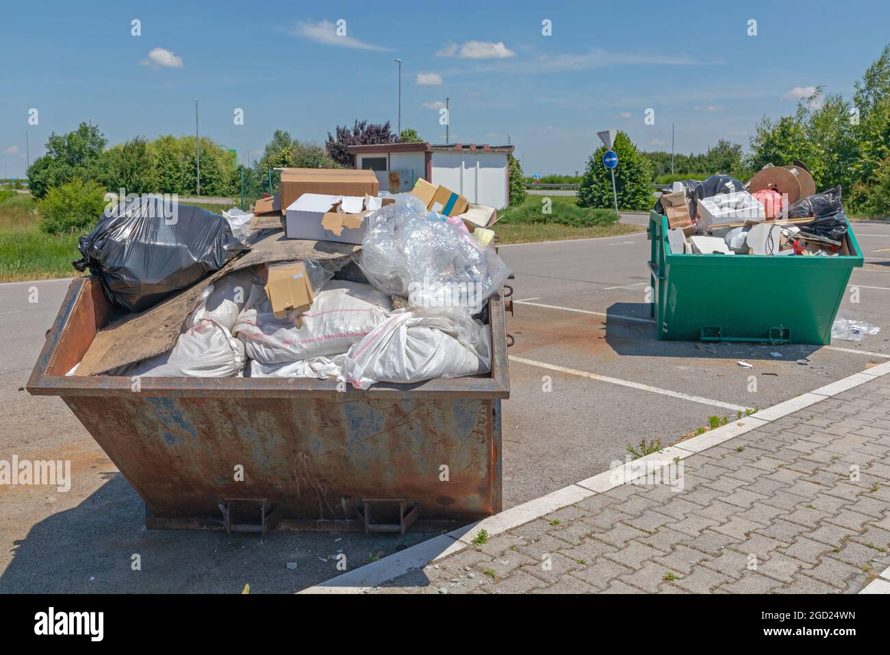 Two Big Skip Trash Containers Overloaded at Parking Places Stock Photo ...