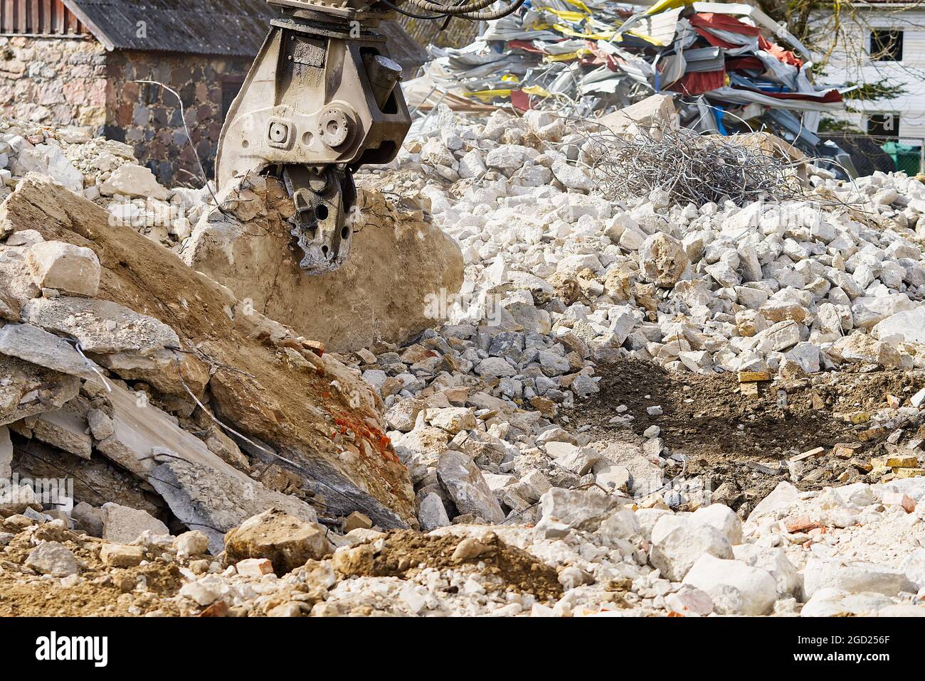 Old stone building demolition with excavator Stock Photo - Alamy