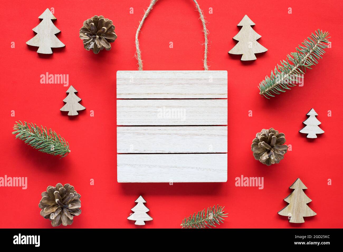 Wooden Sign Board Frame And Christmas Decorations On Red Background