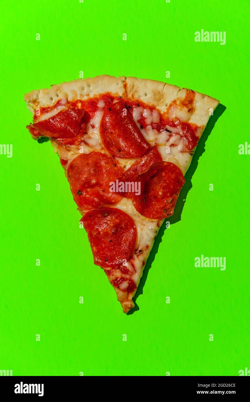 New York style pizza slices on neon colorful background shot with hard ...
