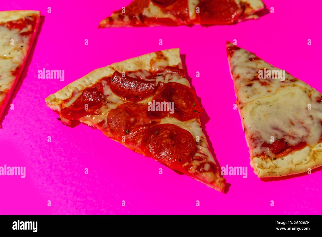 New York style pizza slices on neon colorful background shot with hard ...