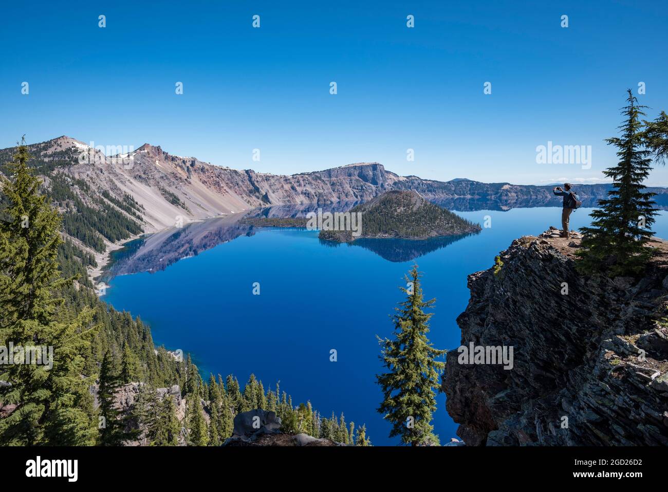 Crater Lake National Park, Oregon: visitor taking photo from viewpoint ...