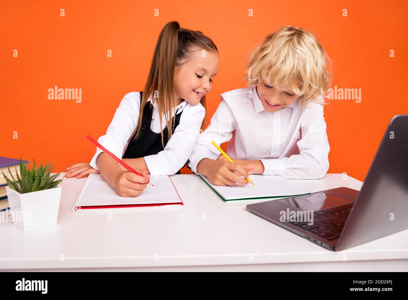 Photo of busy schoolchildren write homework desktop laptop wear uniform ...
