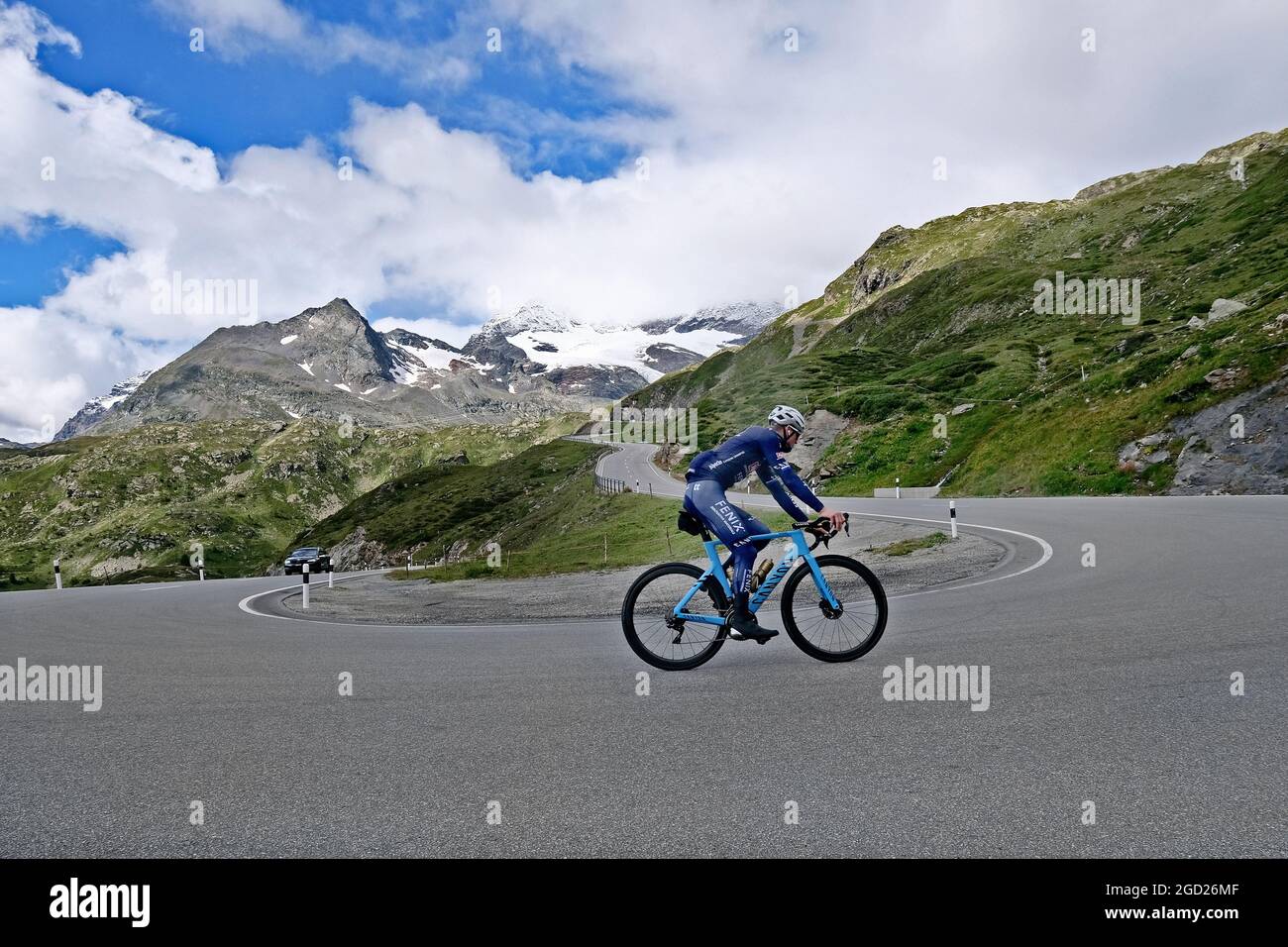 Road cyclist on the mountain pass Bernina, Passo del Bernina, in the ...