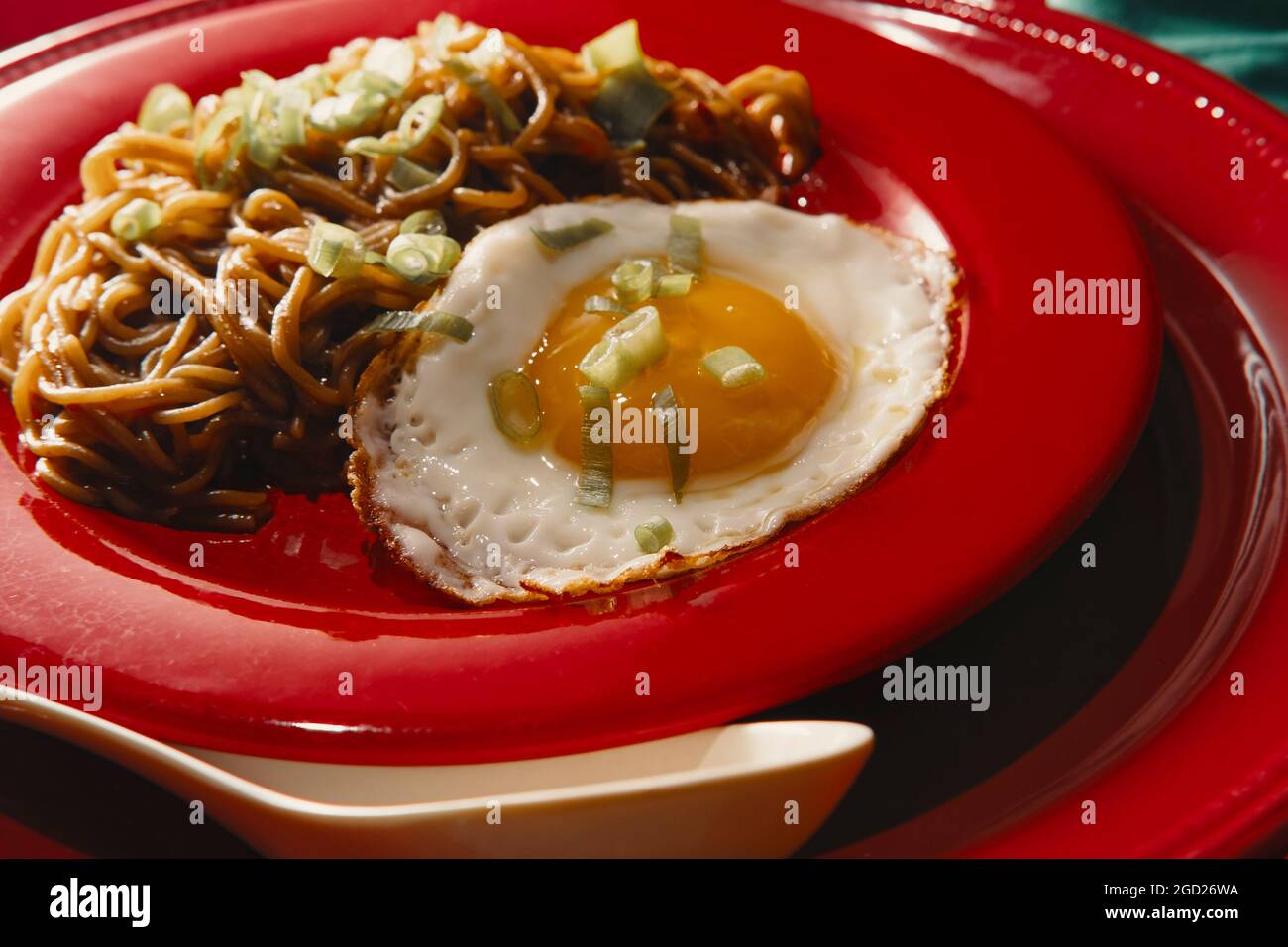 Japanese spicy ramen noodles served with fried sunny side up egg and ...