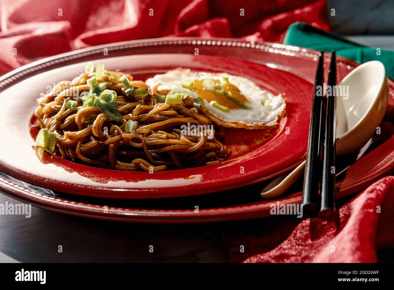 Japanese spicy ramen noodles served with fried sunny side up egg and ...