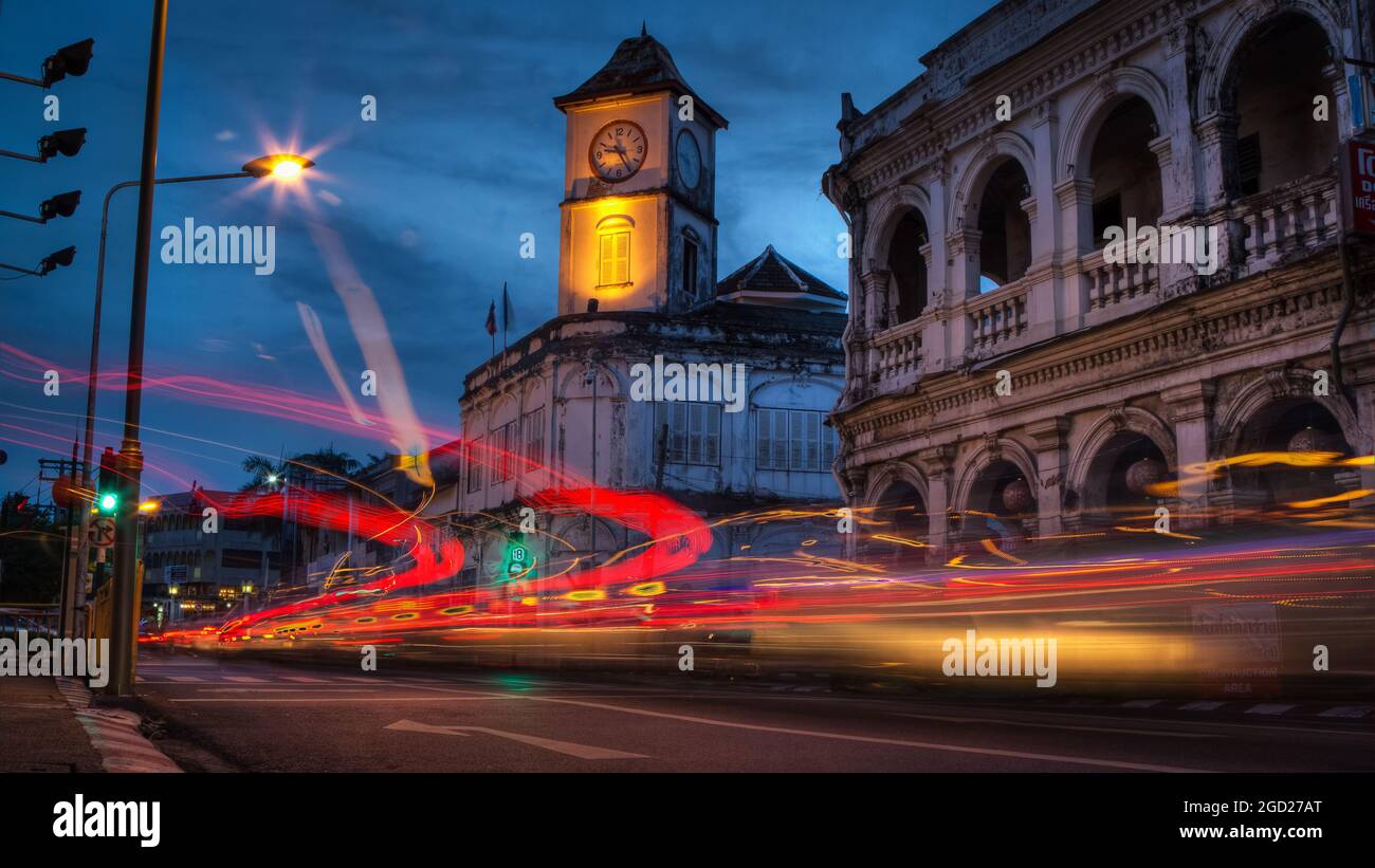 Long exposure of the cars driving around at night in Phuket Old Town ...