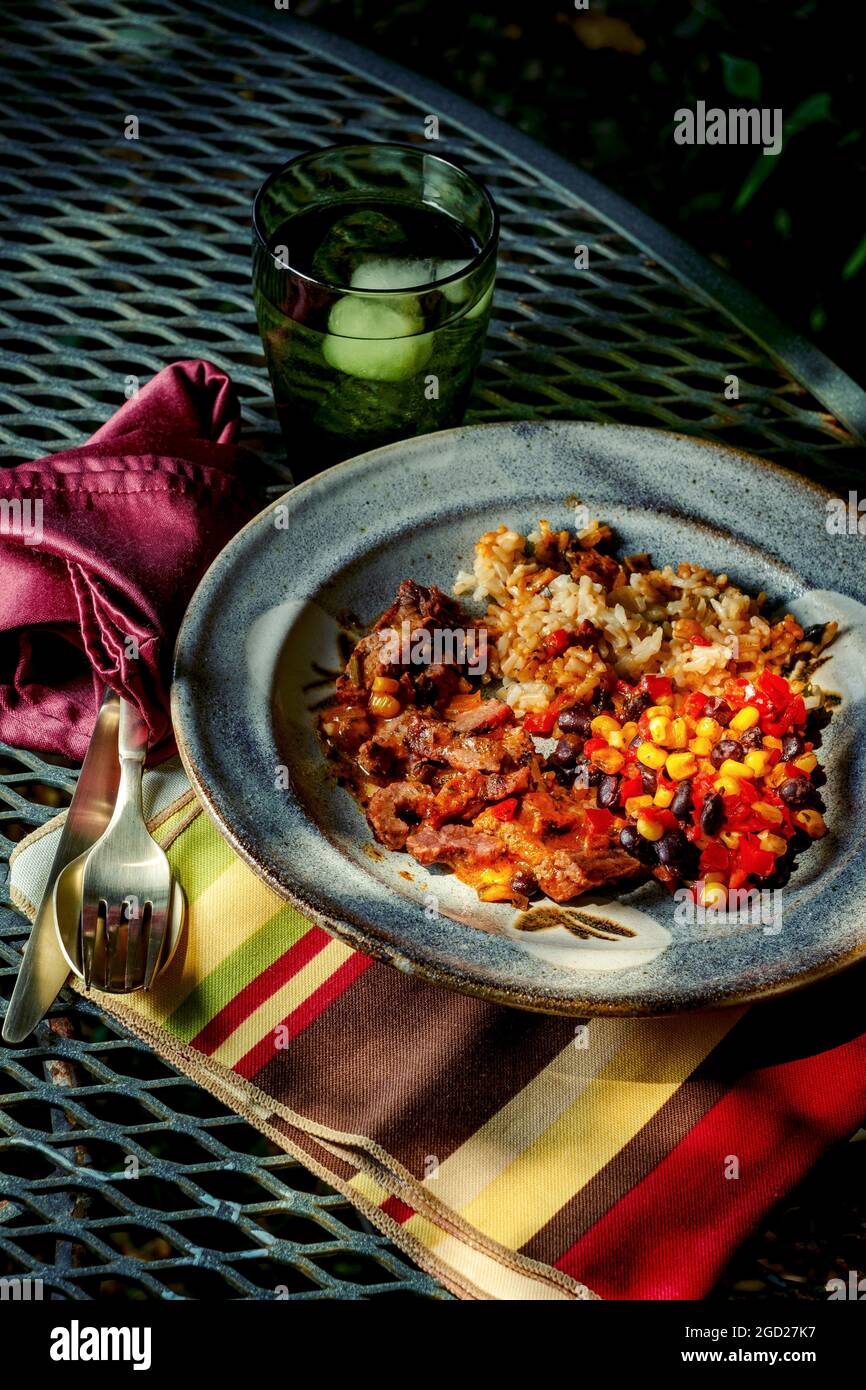 Mexican grilled steak carne asada served with brown rice and beans with ...