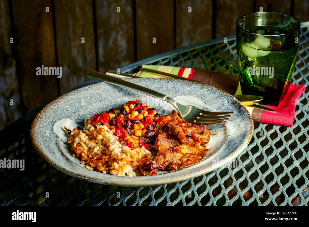 Mexican grilled steak carne asada served with brown rice and beans with ...