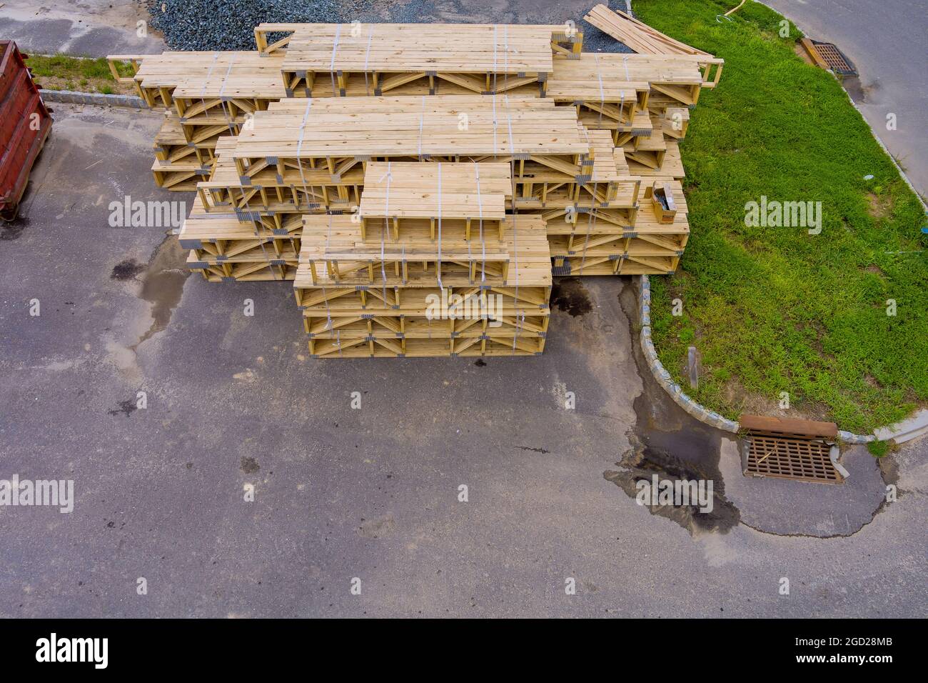 Wood stacked on house building materials from at a construction site ...