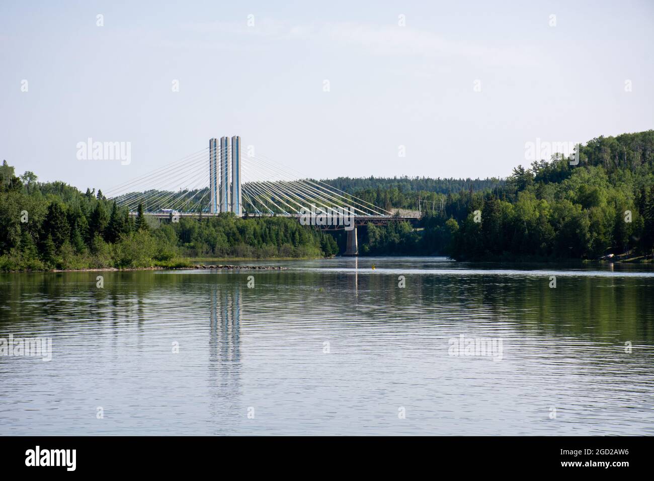 Modern bridge over the large river in a greenery Stock Photo - Alamy