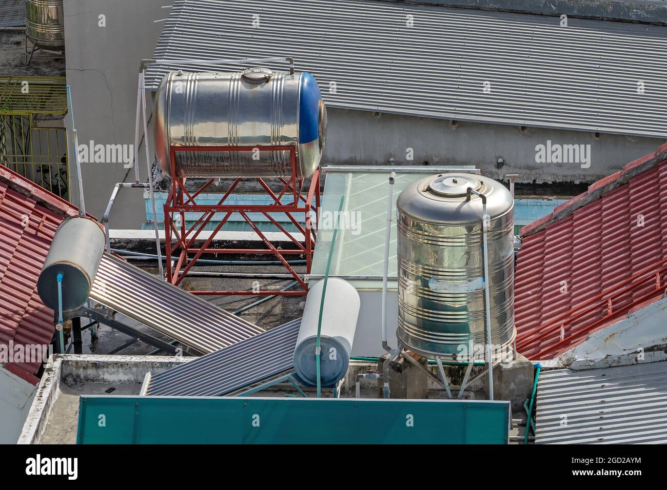 Solar water heater boiler on house roof. Green energy heating system ...