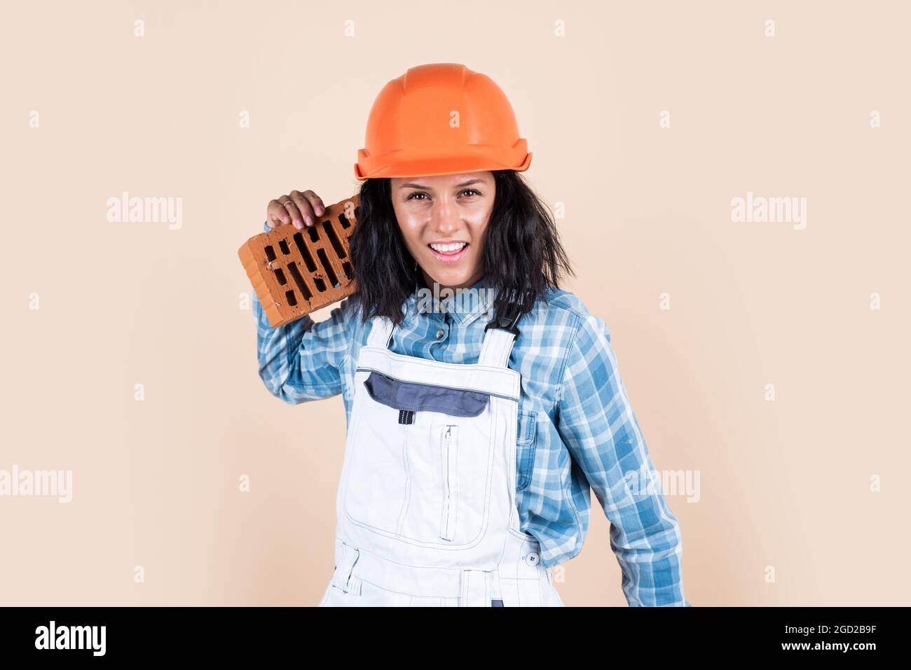 Building tomorrow. girl in workshop uniform. repairing tools used in ...