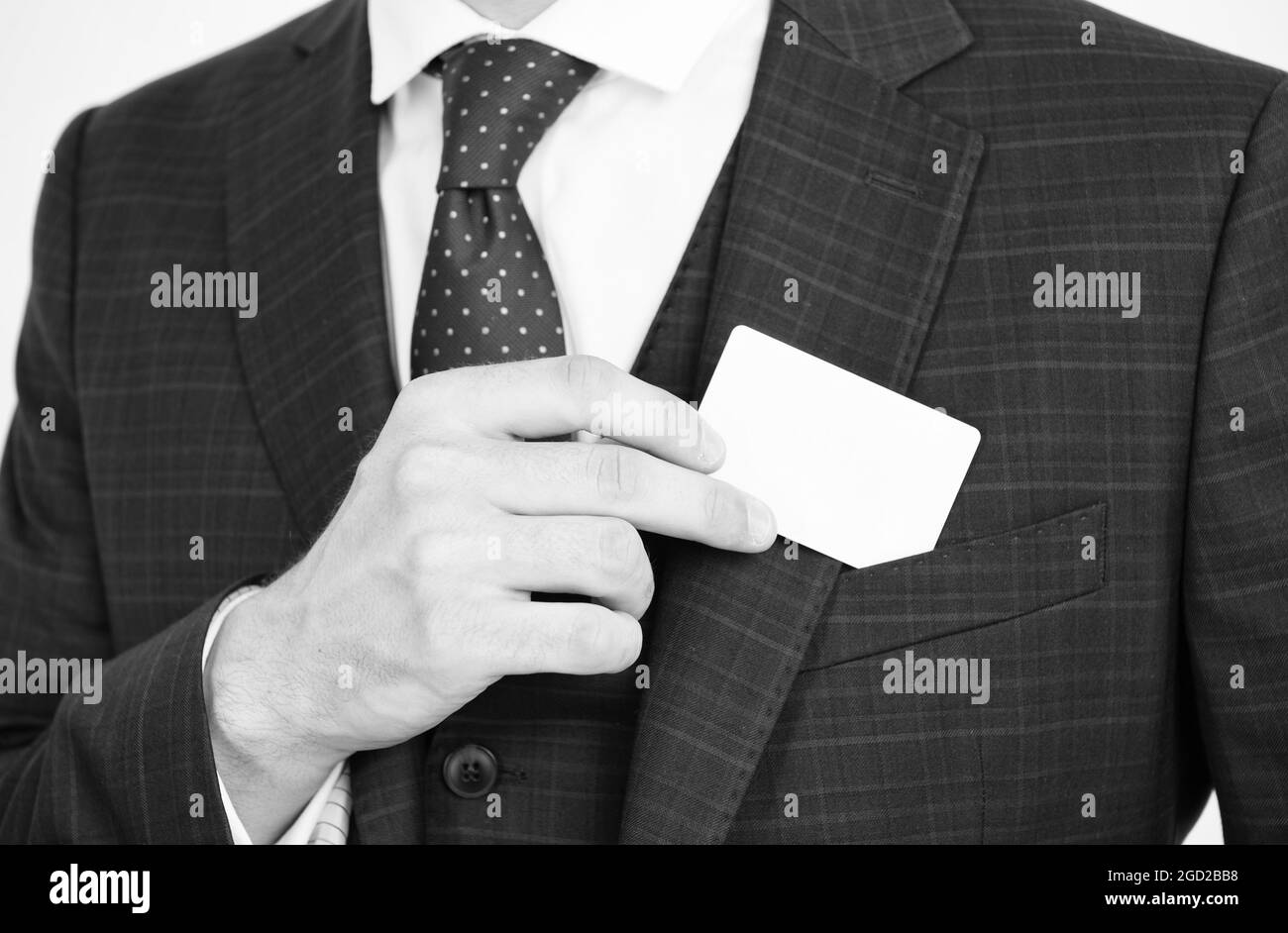 Showing his visiting card. Male hand take card out of suit pocket ...