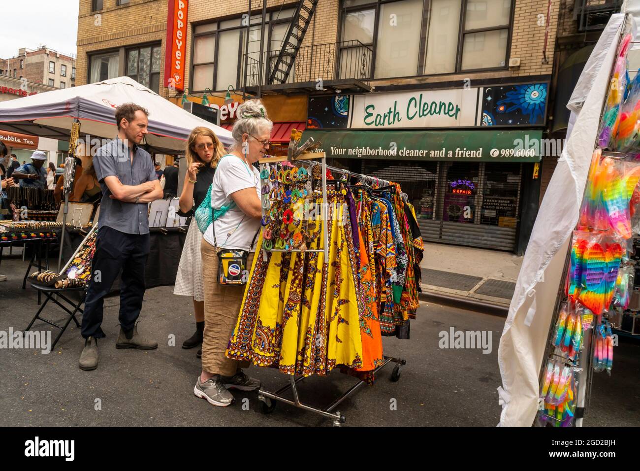 Shoppers and browsers at a street fair in Chelsea in New York on August ...