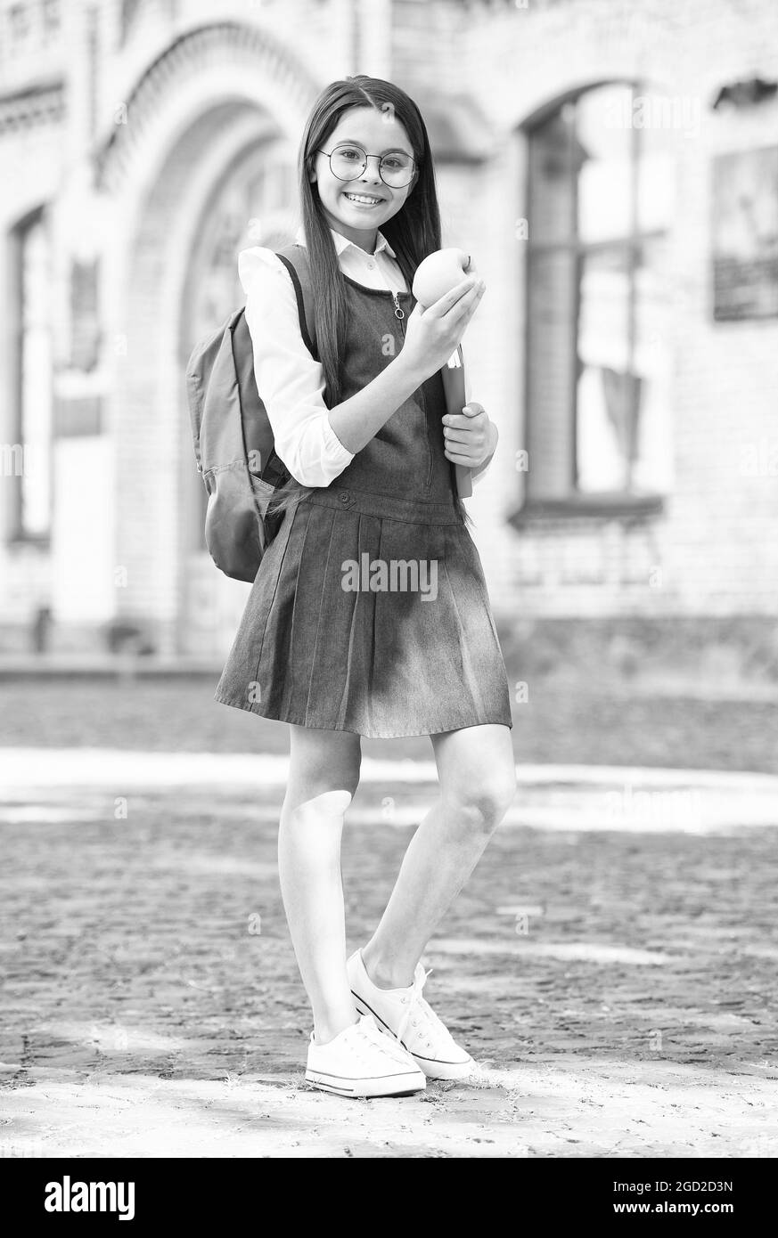 Have you had your break today. Little child hold apple outdoors. School ...