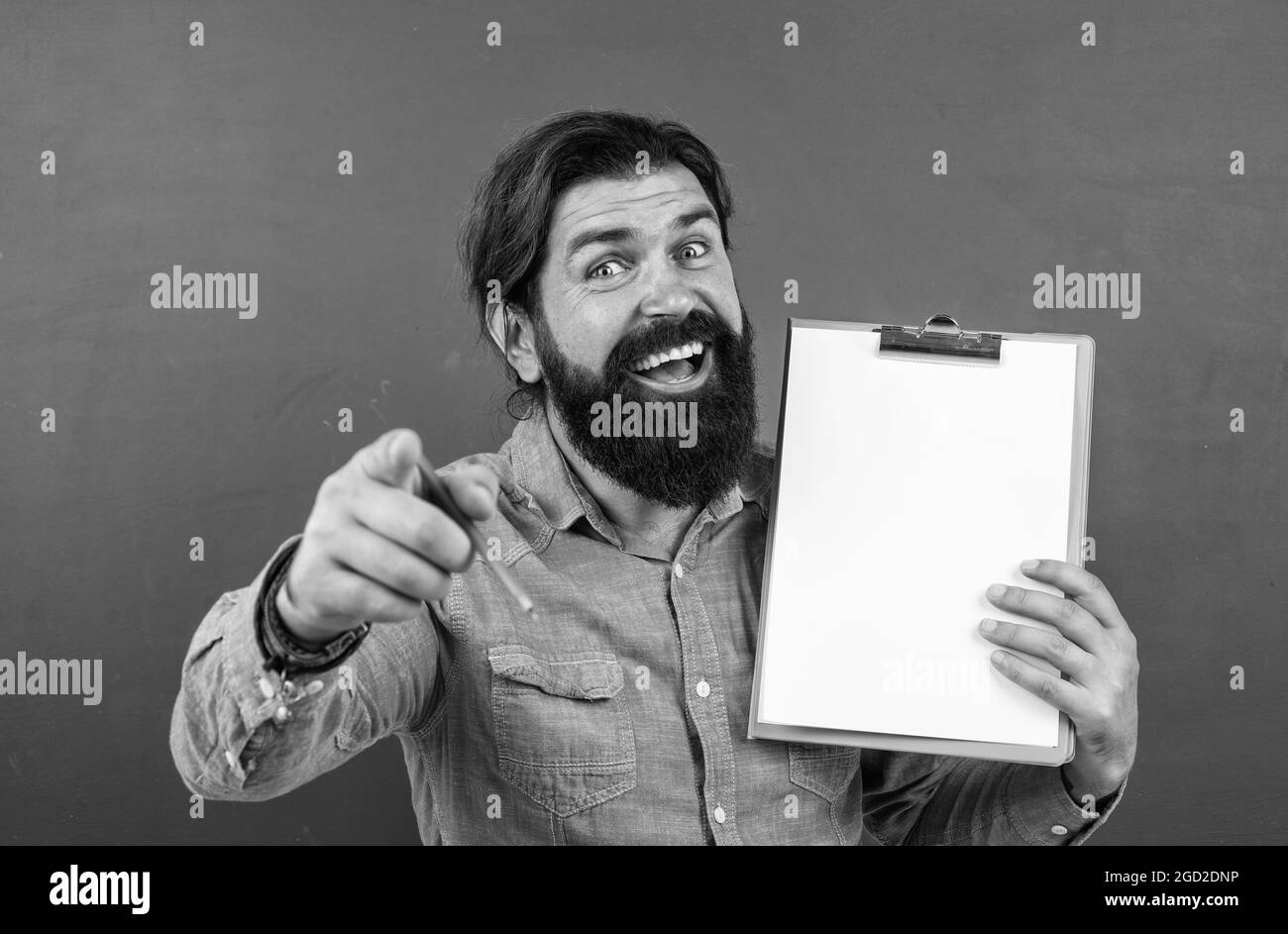 good looking guy with beard and moustache showing document paper for ...